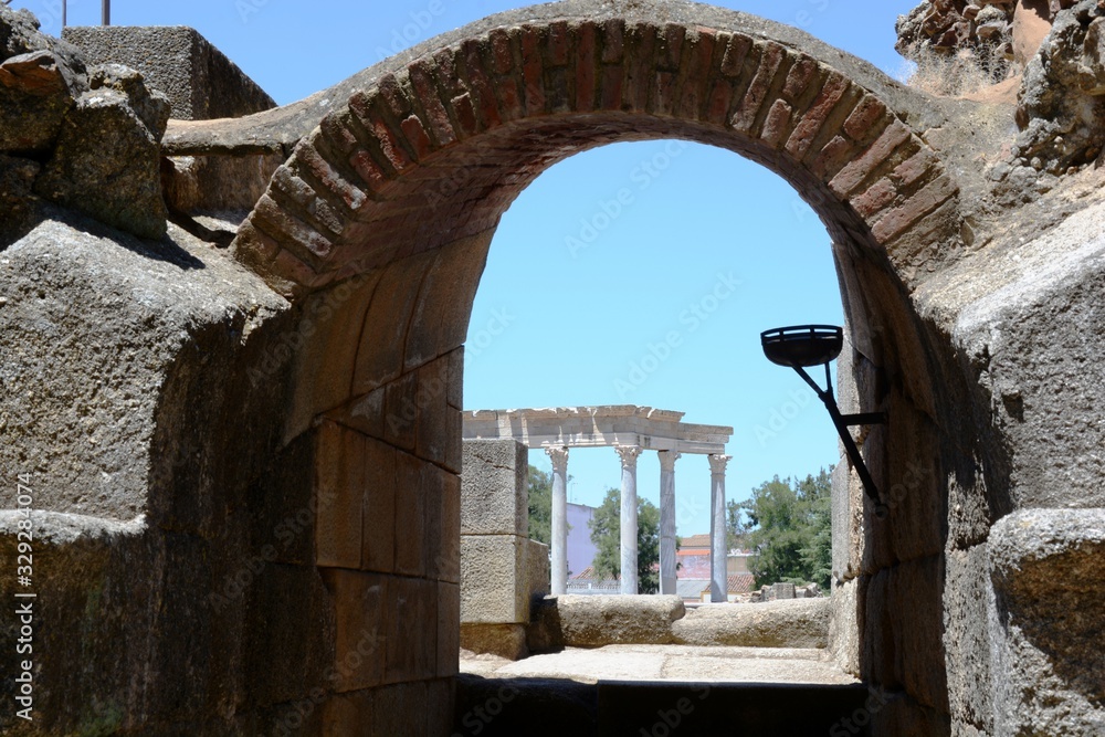 Roman ruins of an arch, wall and columns Stock Photo | Adobe Stock