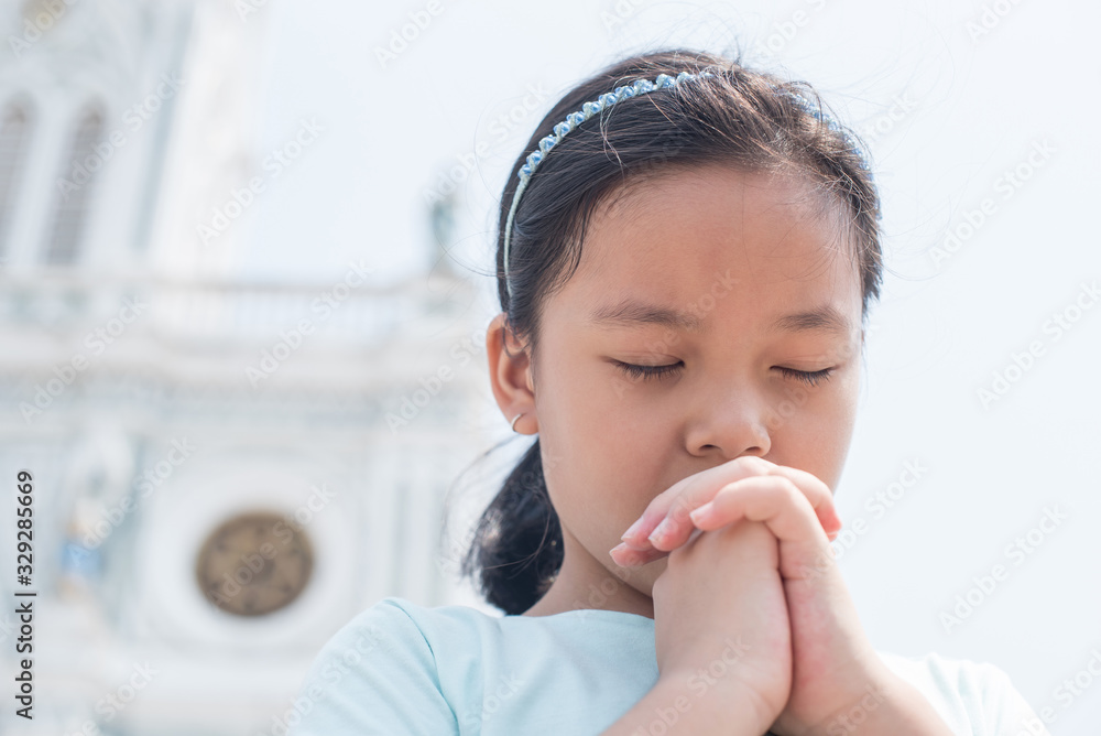cute little girl praying. little girl praying in the morning. little ...