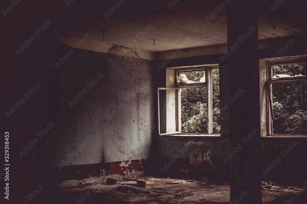 Dark room in an abandoned ruined building. Light from a window Stock ...