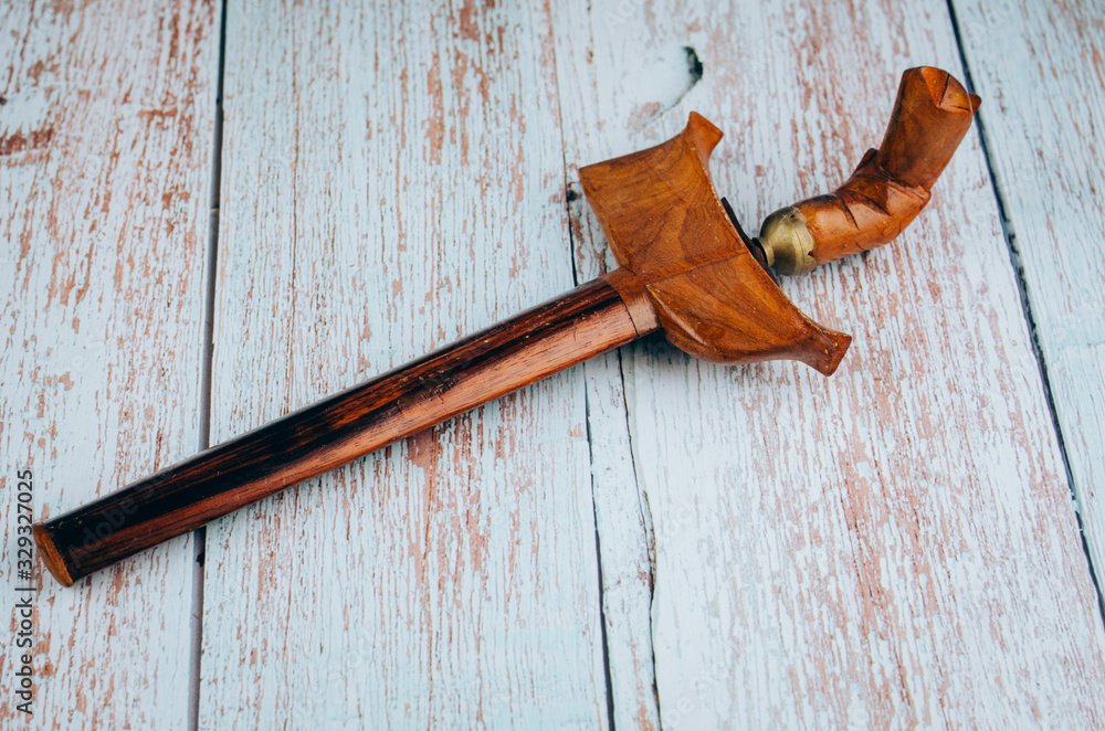 Traditional dagger called Keris on wooden background, Keris is unique ...