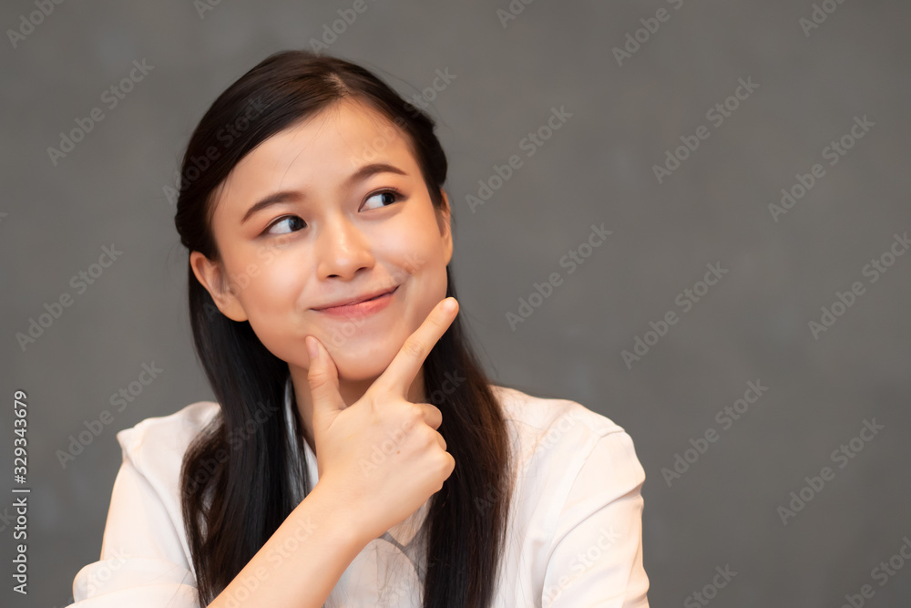 smart thoughtful asian woman thinking, planning; portrait of asian ...
