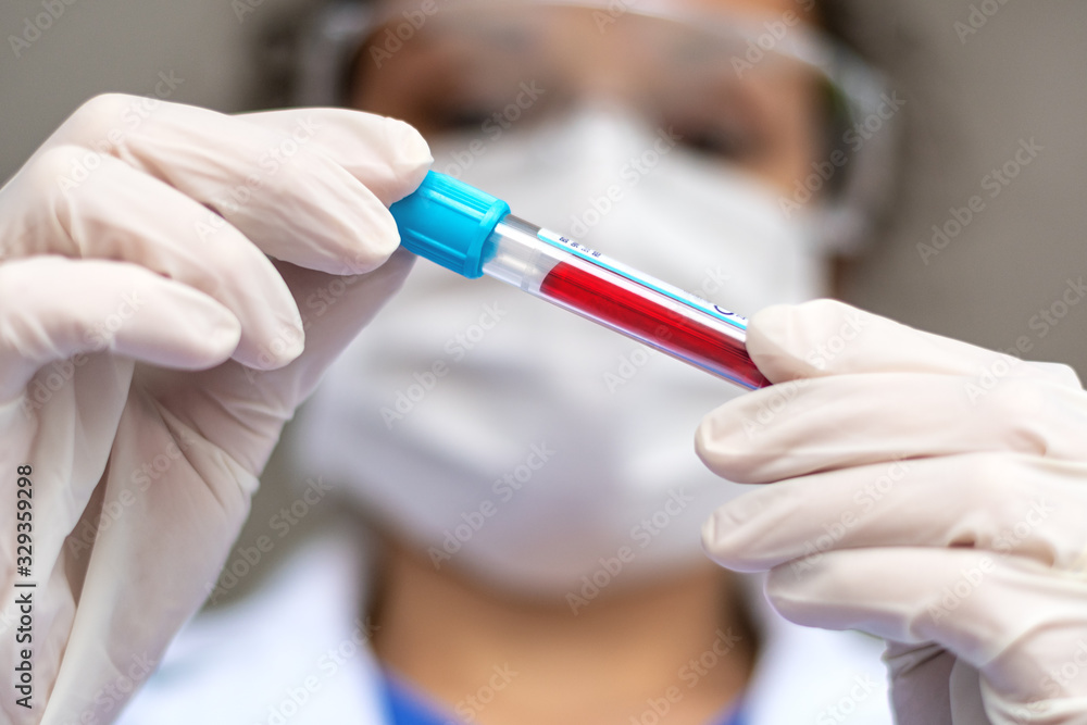 Biology and science. Scientist holding a test tube. Virus or bacteria ...