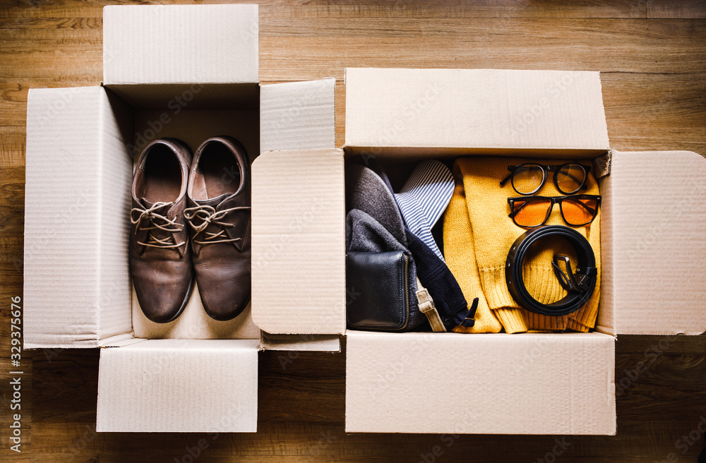 Moving home and donation concepts with accessories clothing in brown ...