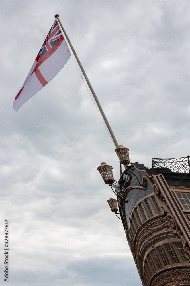 The white ensign flying above the stern of HMS Victory, Lord Nelsons ...