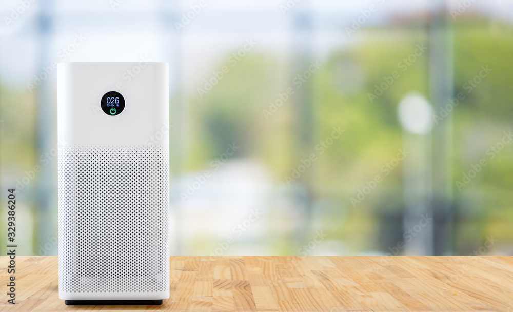 air purifier a living room, air cleaner removing fine dust in house ...