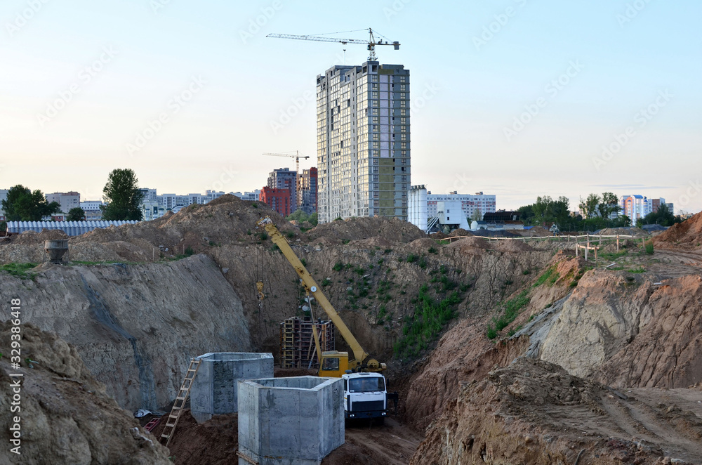Crane operation in the pit, laying or replacement of underground storm ...