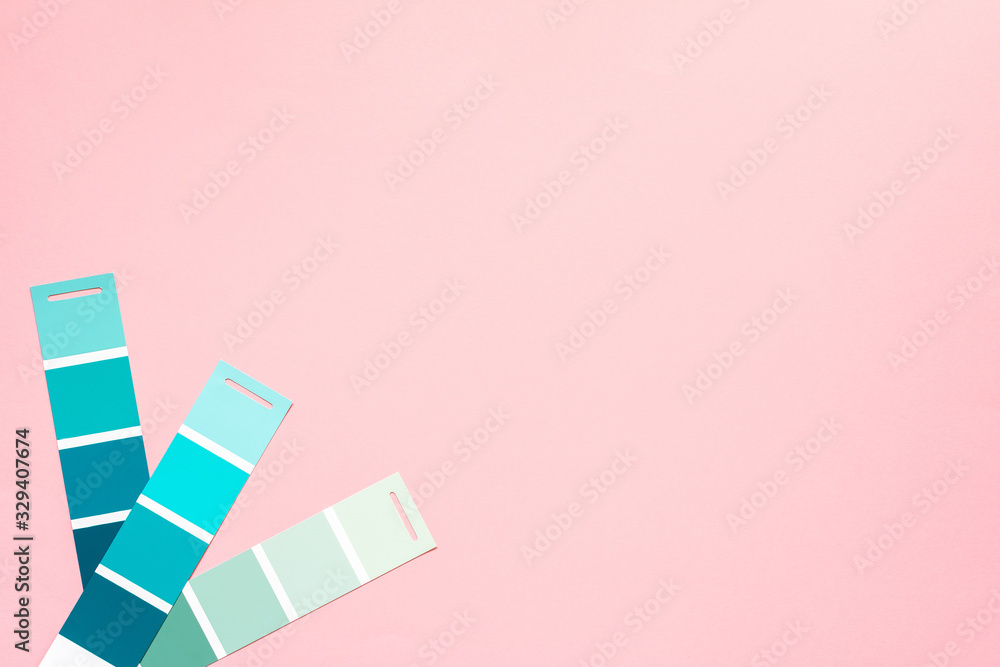 Selection of palette for painting, sample color catalog on a pink ...