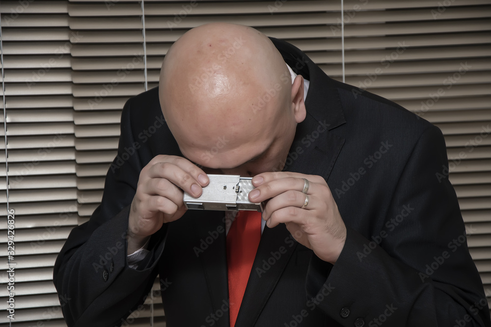 Spy photographs secret materials on a mini camera, collecting ...