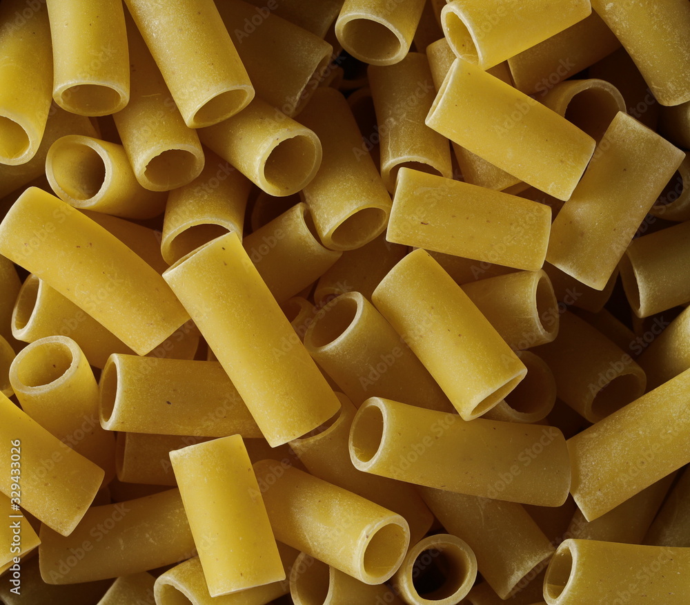Uncooked smooth short tubes shape pasta also known as tubetti lisci ...