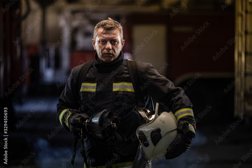 firefighter portrait wearing full equipment and emergency rescue ...