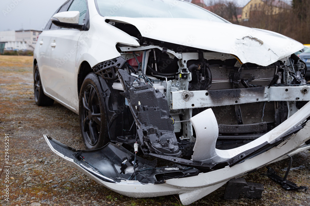 Damaged front of a car caused by an accident Stock Photo | Adobe Stock