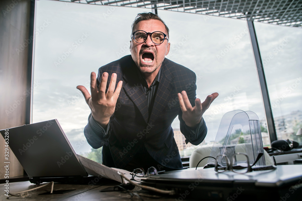 angry boss screaming and waving his arms mad at the office Stock Photo ...