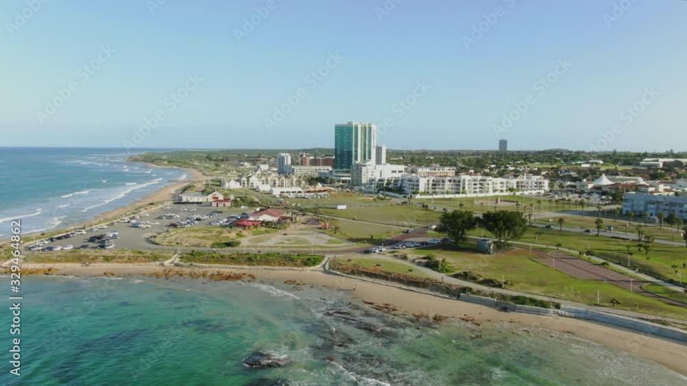 Dramatic aerial dolly zoom approaching Pollok Beach in Port Elizabeth ...