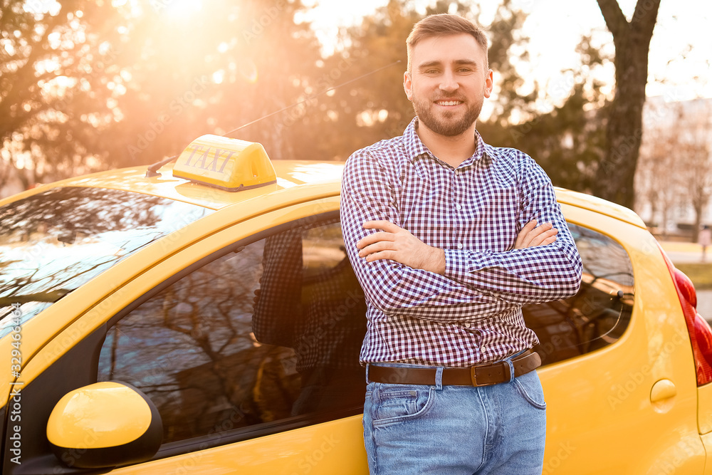Portrait of handsome taxi driver outdoors foto de Stock | Adobe Stock