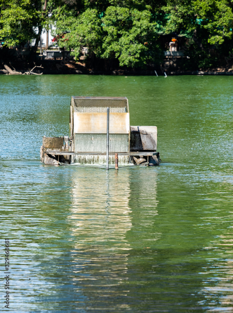Water oxygen generator rotated on tehe pond. Water turbine fill oxygen ...