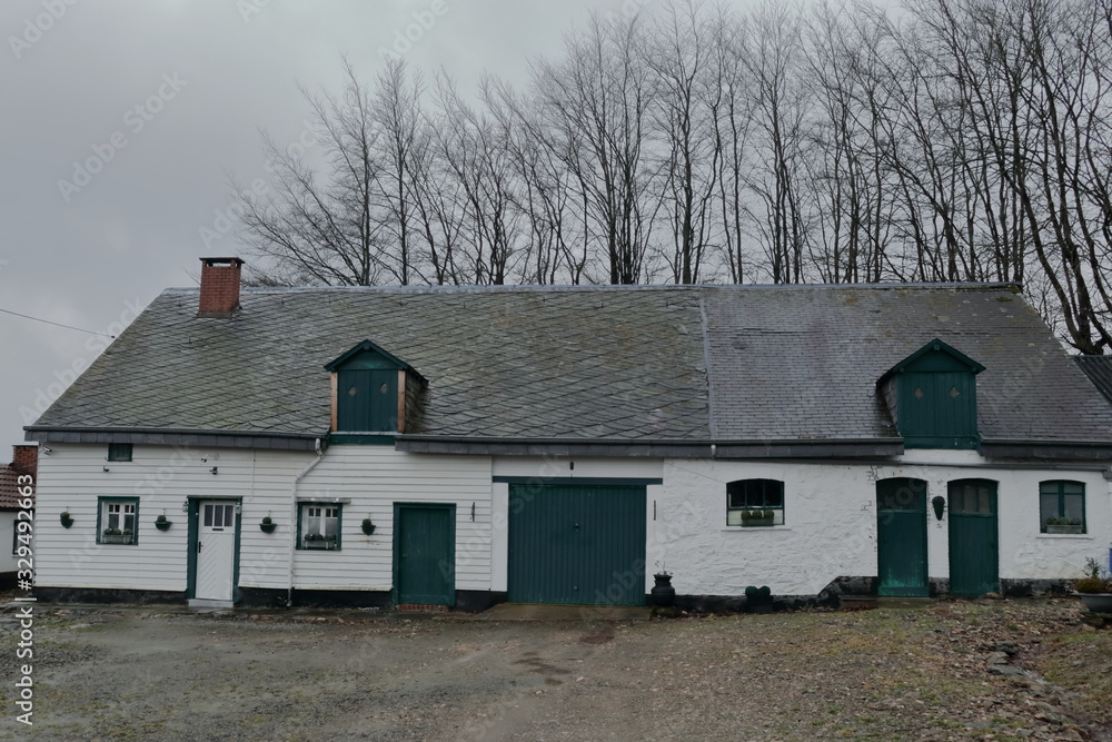 typical Belgian traditional farmhouse in a small village in Wallonia ...