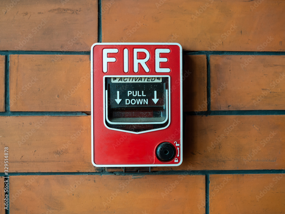 Red manual pull fire alarm safety system. Pull station or call point ...