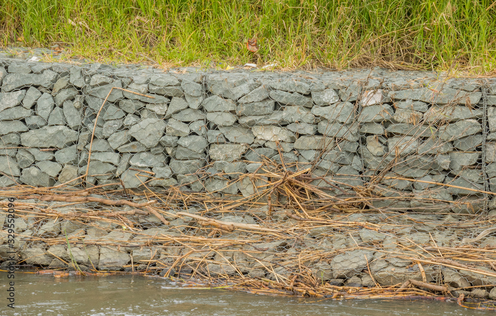 Gabion retaining walls to control erosion and flooding on the banks of ...