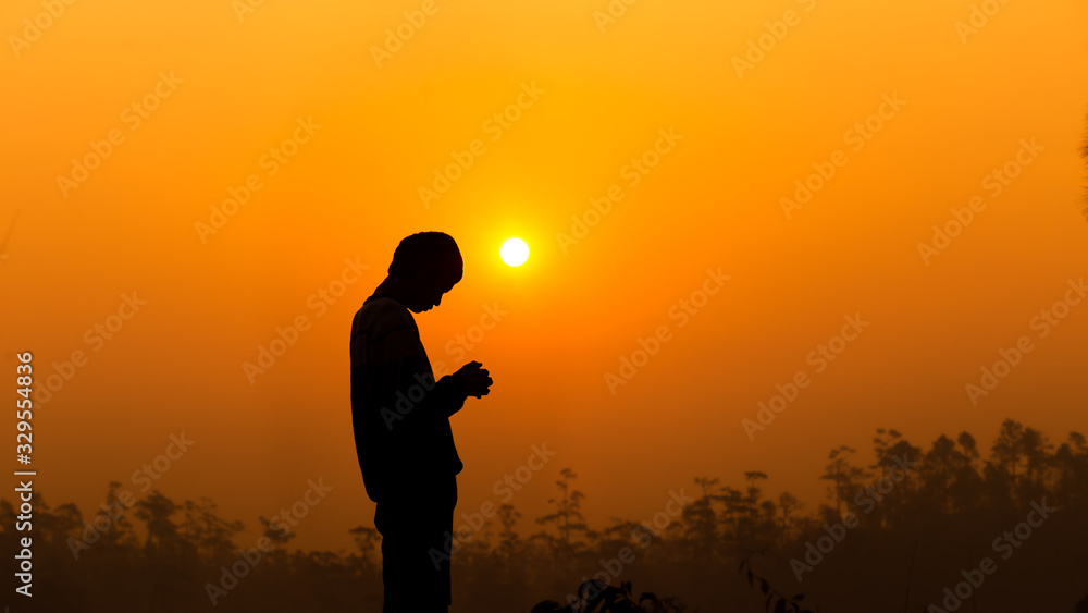 Human praying with light sunset background, christian silhouette ...