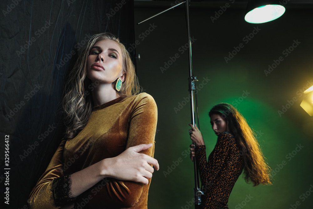 Fashion photo session in the studio. Beautiful woman model. Yellow ...