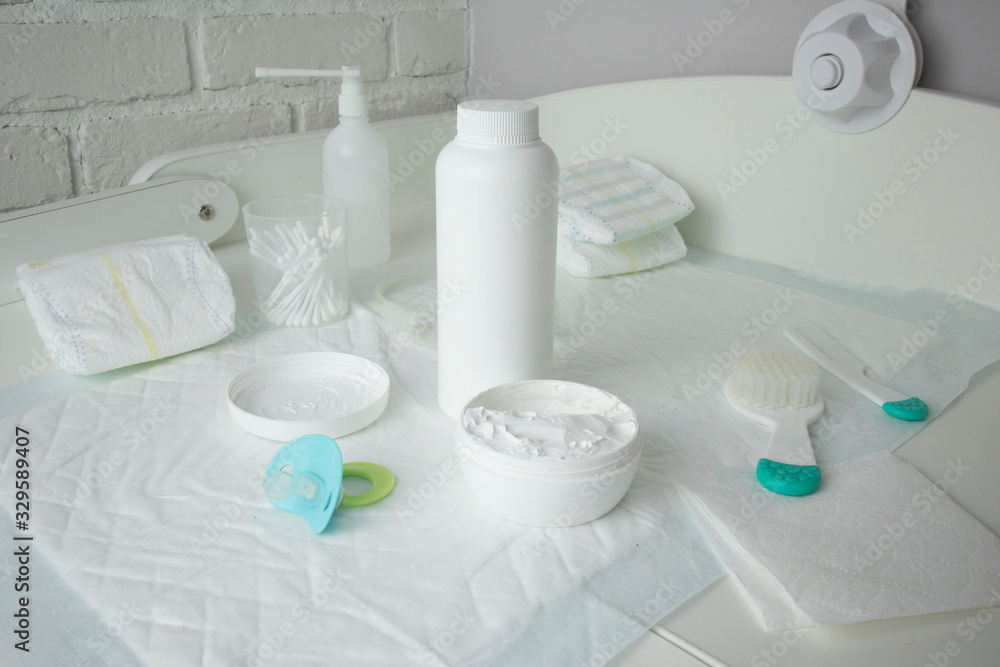 changing table and baby care products-powder, cream, pacifier, diapers ...