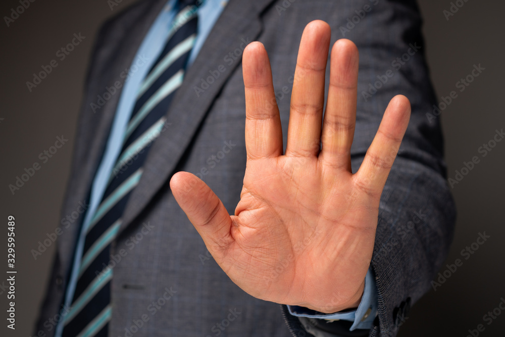 Businessman show hand sign for stop and holding, Concept of ...