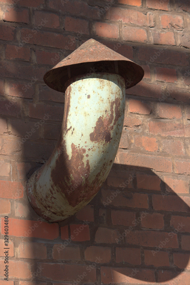 rusted smoke vent on an outside wall of an old factory Stock Photo ...