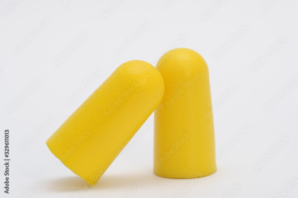 Foam ear plugs isolated on white background. Yellow ear plugs isolated ...