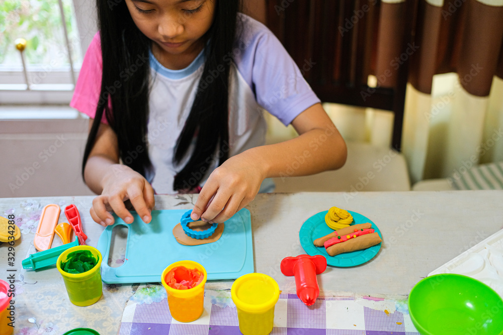 cute Thai girl black long hair playing dough mould creative and skill ...