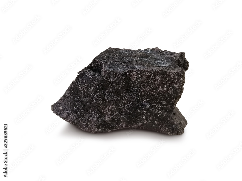 Lignite coal on white background. Lignite is a soft, brown, combustible ...