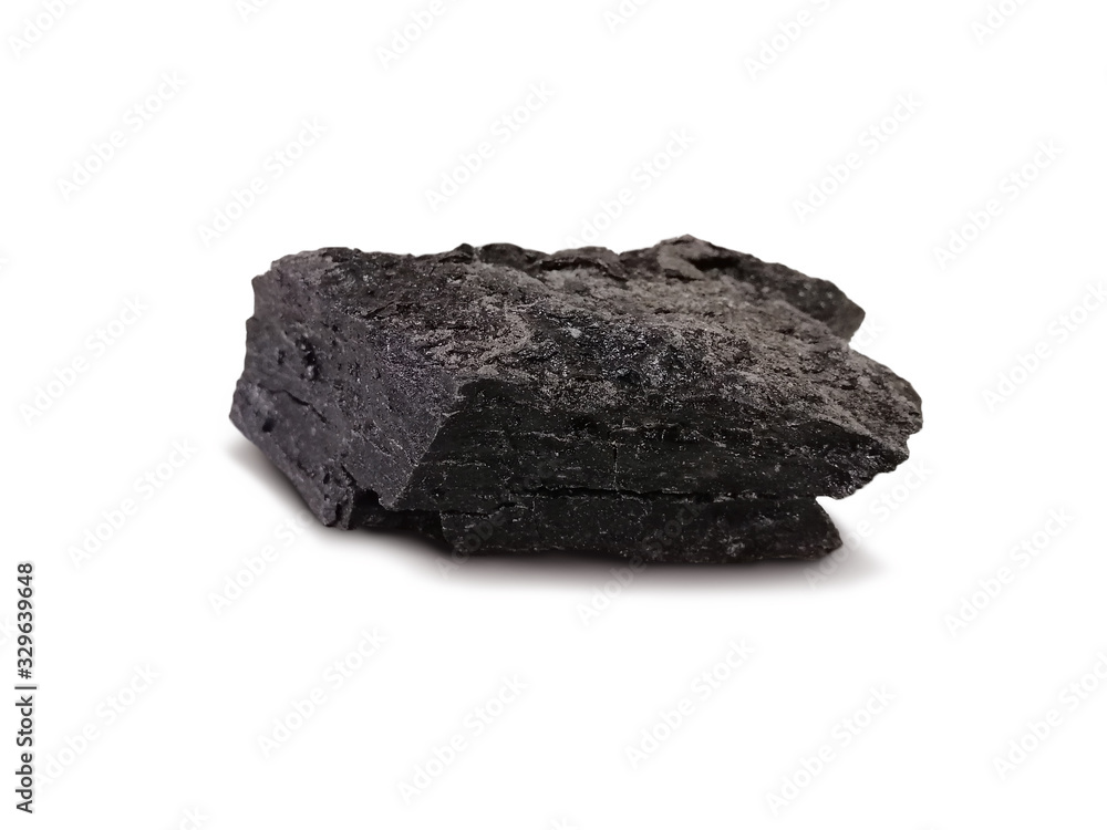 Lignite coal on white background. Lignite is a soft, brown, combustible ...