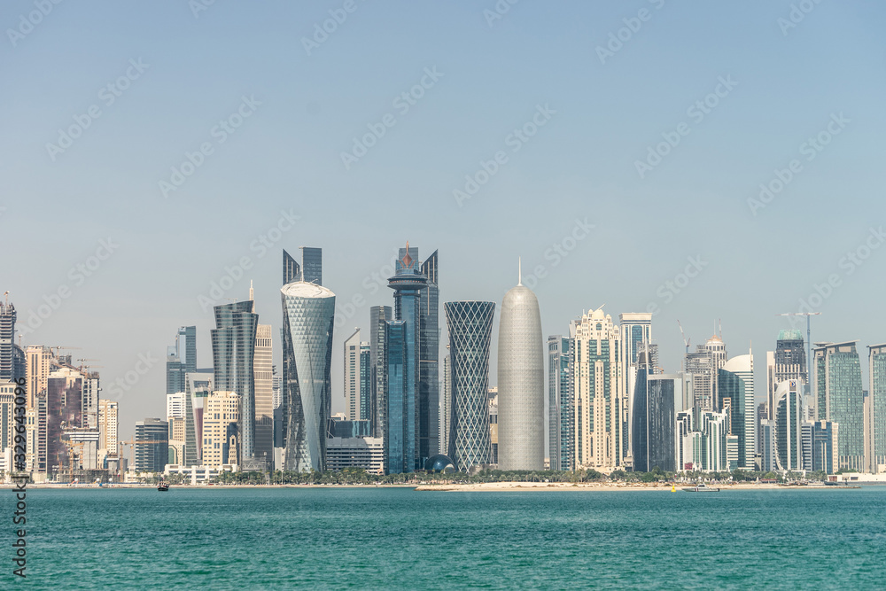 View of city center with skyscrapers from the other side of sea in Doha ...