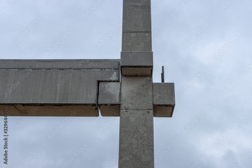 concrete cross beams are connected to concrete columns for a factory ...