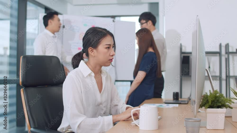 Millennial young Chinese businesswoman working stress out with project ...