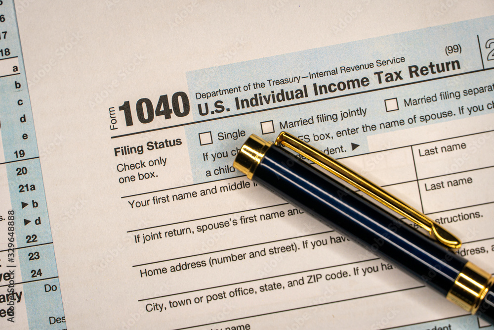 Tax forms 1040. U.S Individual Income Tax Return. background close-up ...