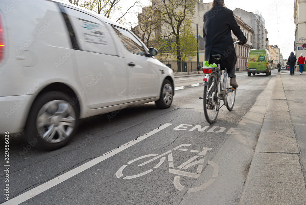 Dangerous encounter between cyclist and car at the end of a marked bike ...