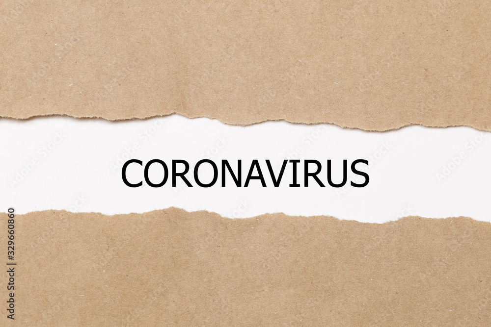 The word CORONAVIRUS appearing behind torn paper Stock Photo | Adobe Stock