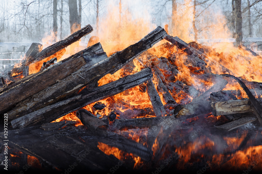 Burning logs of the house became white with temperature. Flames swept ...