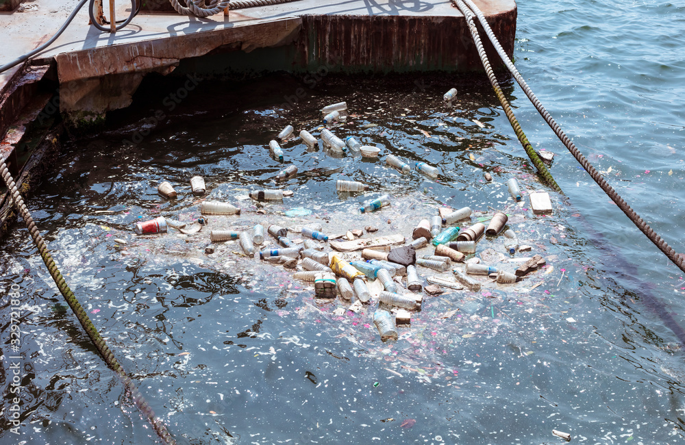 plastic bottles, bags, wastes floating in water. Sea ocean water ...