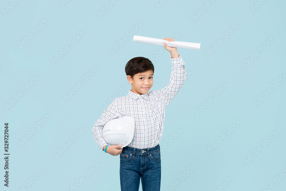 Cute smiling young Asian boy with helmet aspiring to be future engineer ...