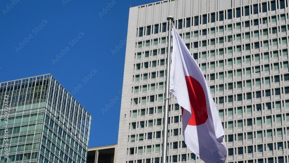 Japan flag with background of modern high-rise building in Tokyo,Japan ...