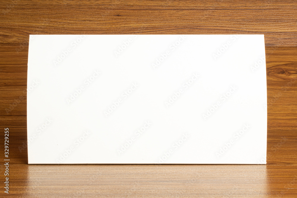Blank paper table tent table-tent on woodenbackground as template for ...