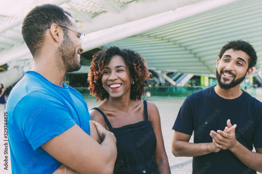 Multiethnic group of friends meeting outside and having fun. Diverse ...