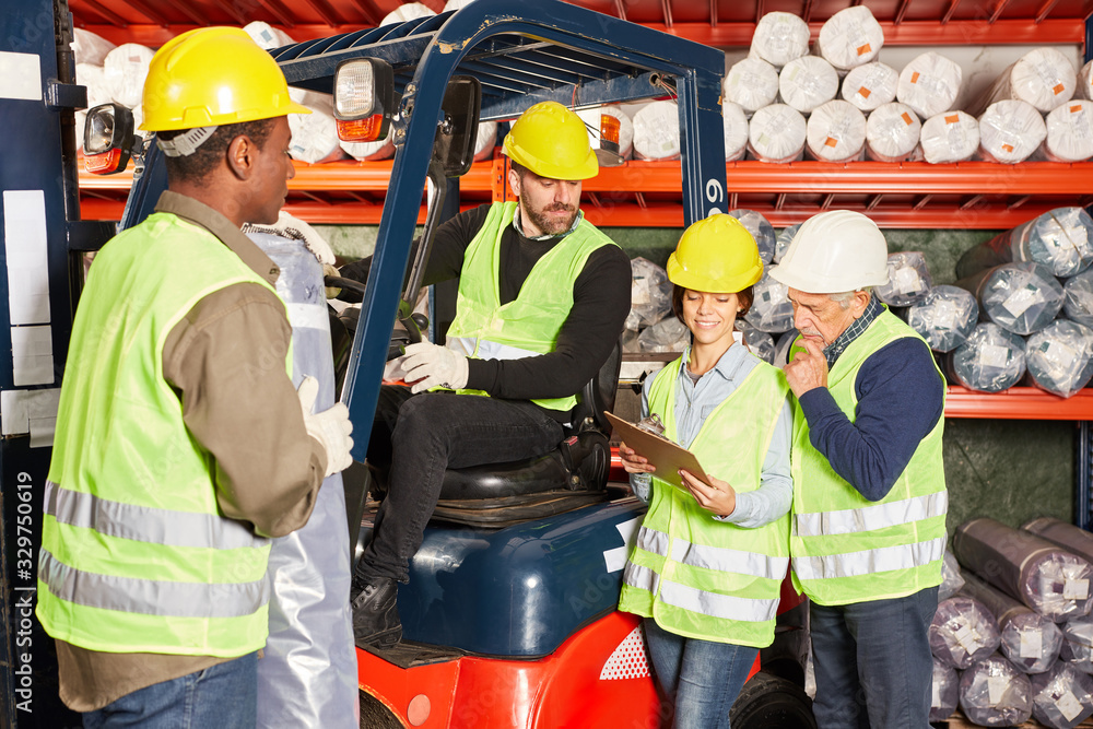 Logistics team works together in the warehouse Stock Photo | Adobe Stock