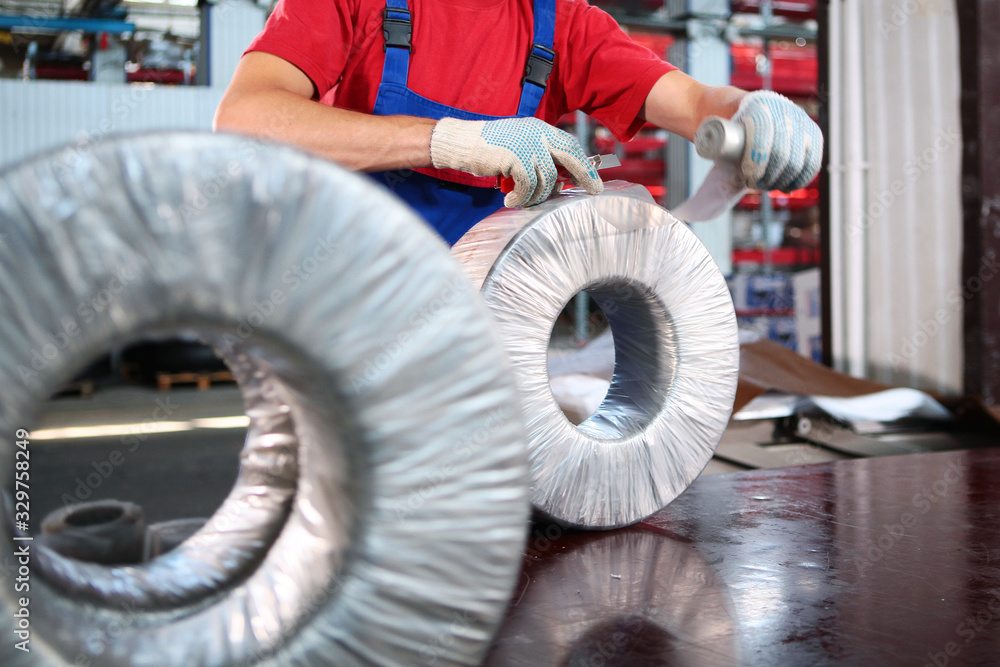 Packing of bearings in production. Photo without a face in the interior ...
