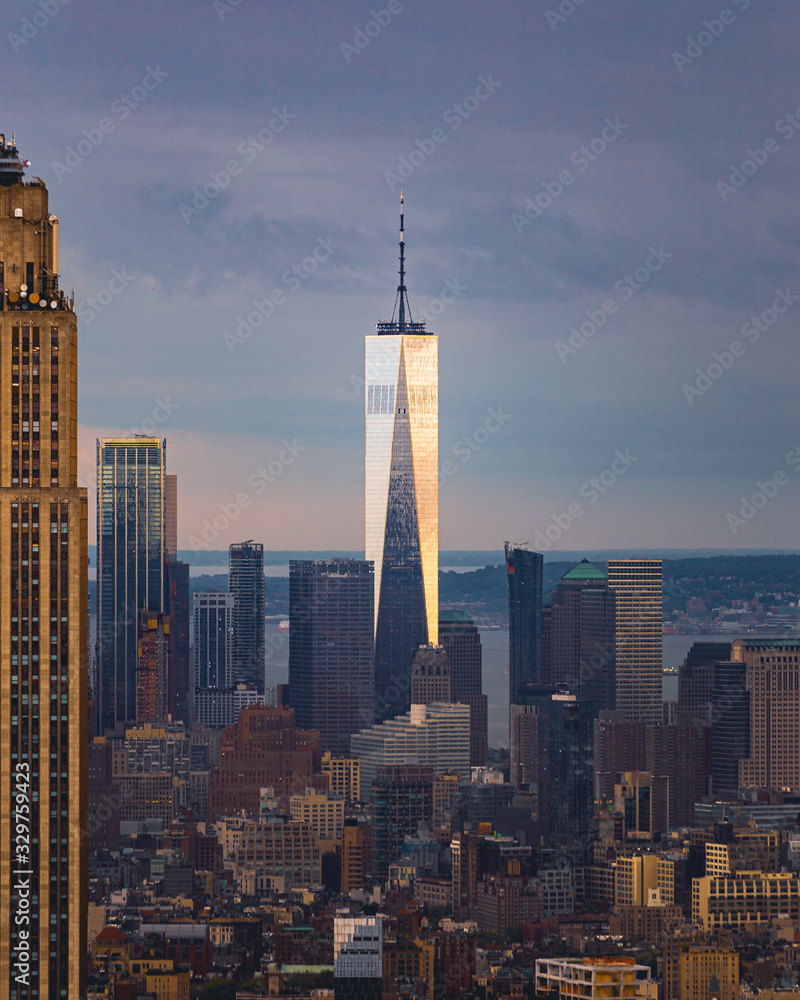 Sunset view of the new World Trade Center from rooftop in NYC, USA ...
