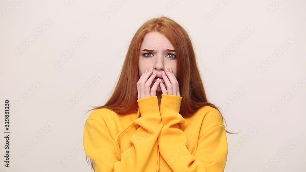 Scared shocked ginger redhead curly young girl in yellow streetwear ...