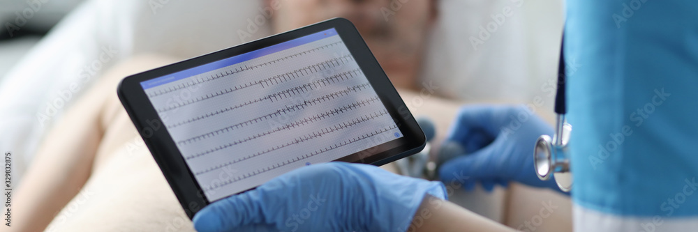 Focus on doctor hands in medical gloves touching screen of modern ...