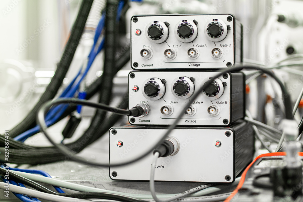 Various wires and cables connected to 3 science laboratory electric ...