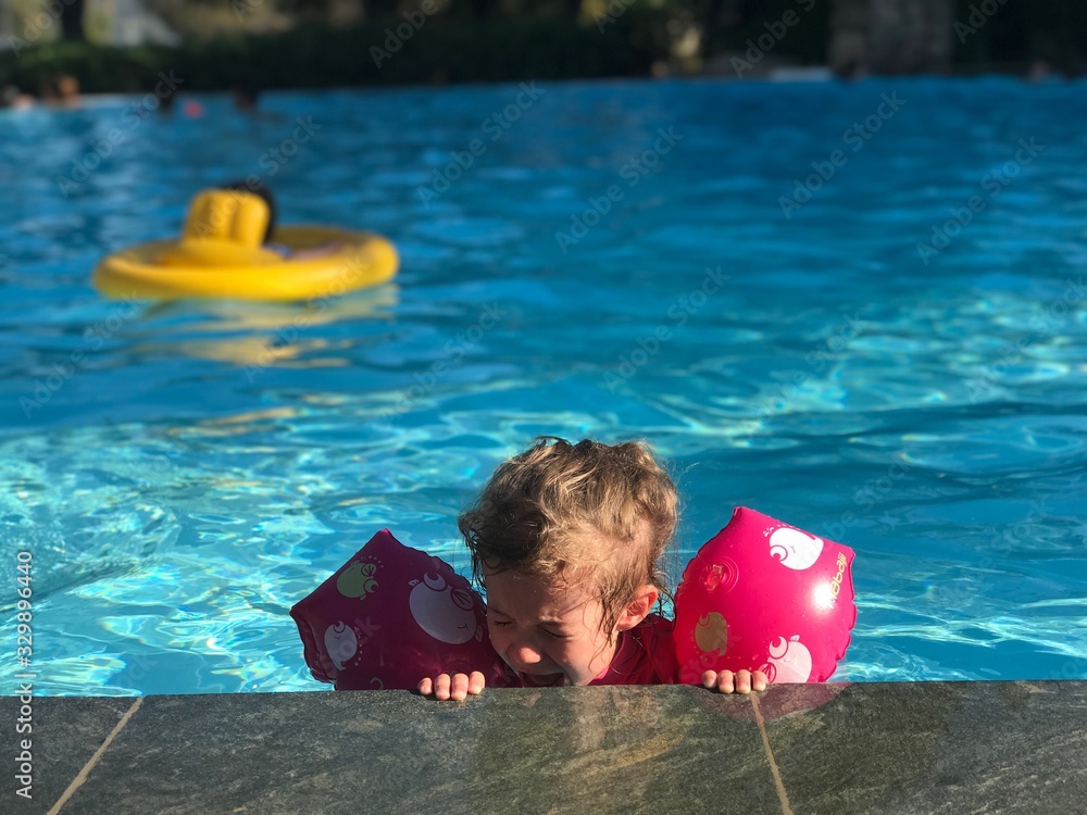 Cute Girl Crying In Swimming Pool Stock Photo | Adobe Stock